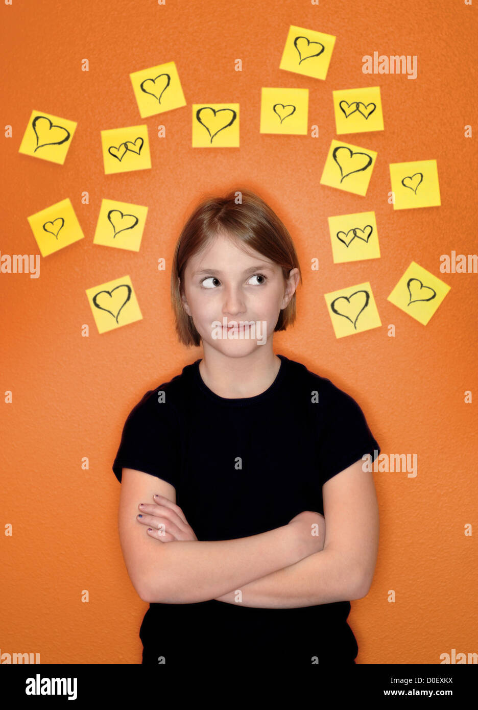 Young girl with sticky notes around her head representing her thoughts ...