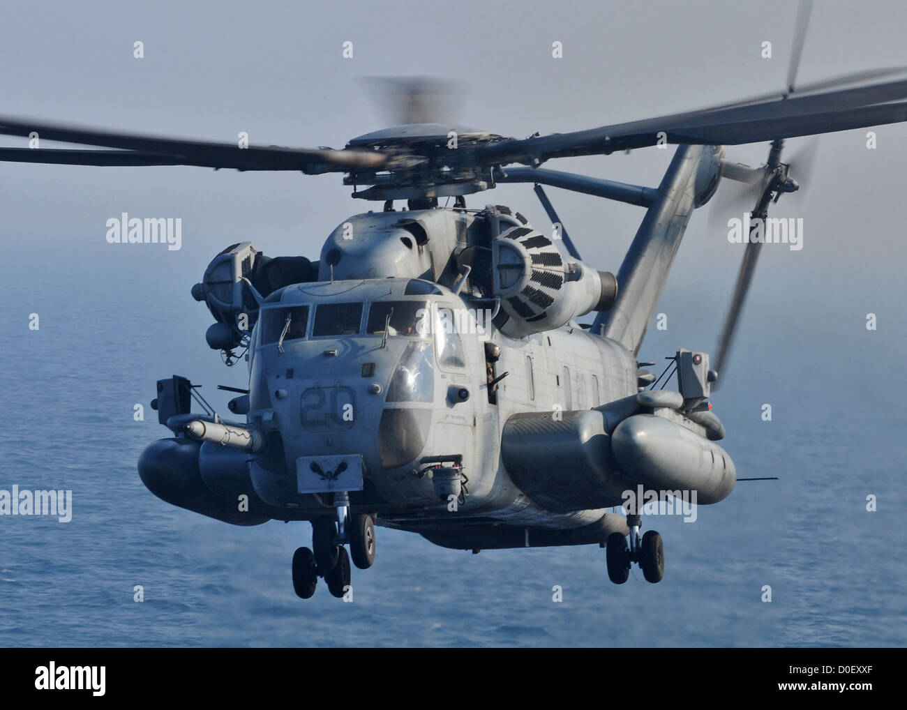 A CH-53 Super Stallion helicopter takes off from the flight deck of the ...