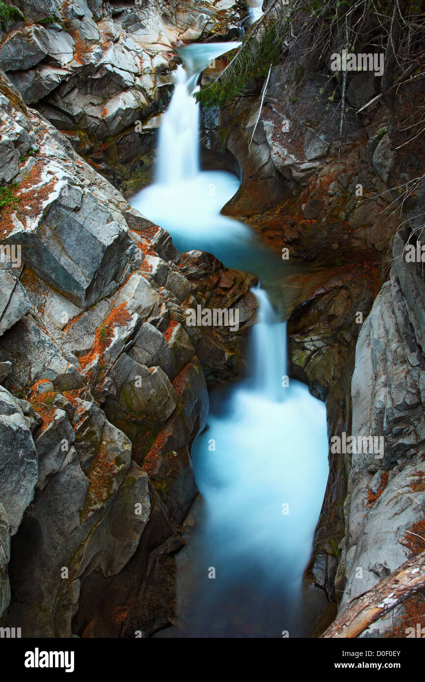 Waterfalls cascade through rugged rocks on Van Trump Creek, in Mount ...