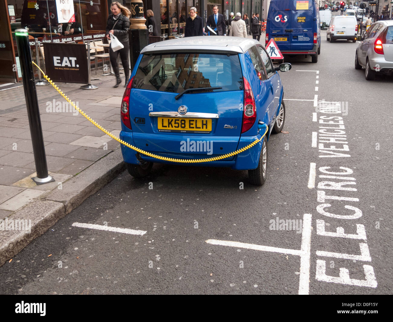 Electric car charging in street in London Stock Photo - Alamy