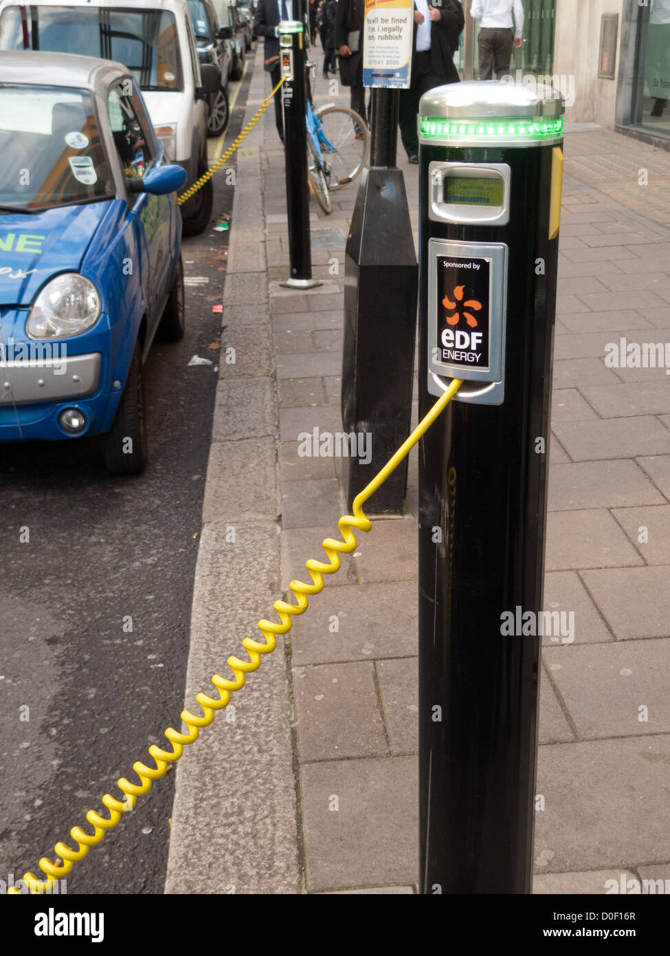 Electric car charging in street in London Stock Photo - Alamy