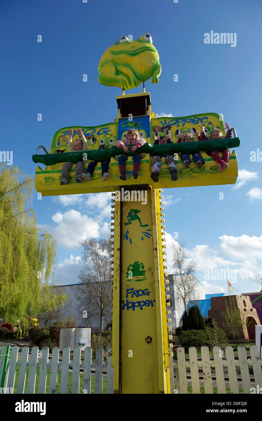 Children riding on a fairground ride at Flamingo land resort in North ...
