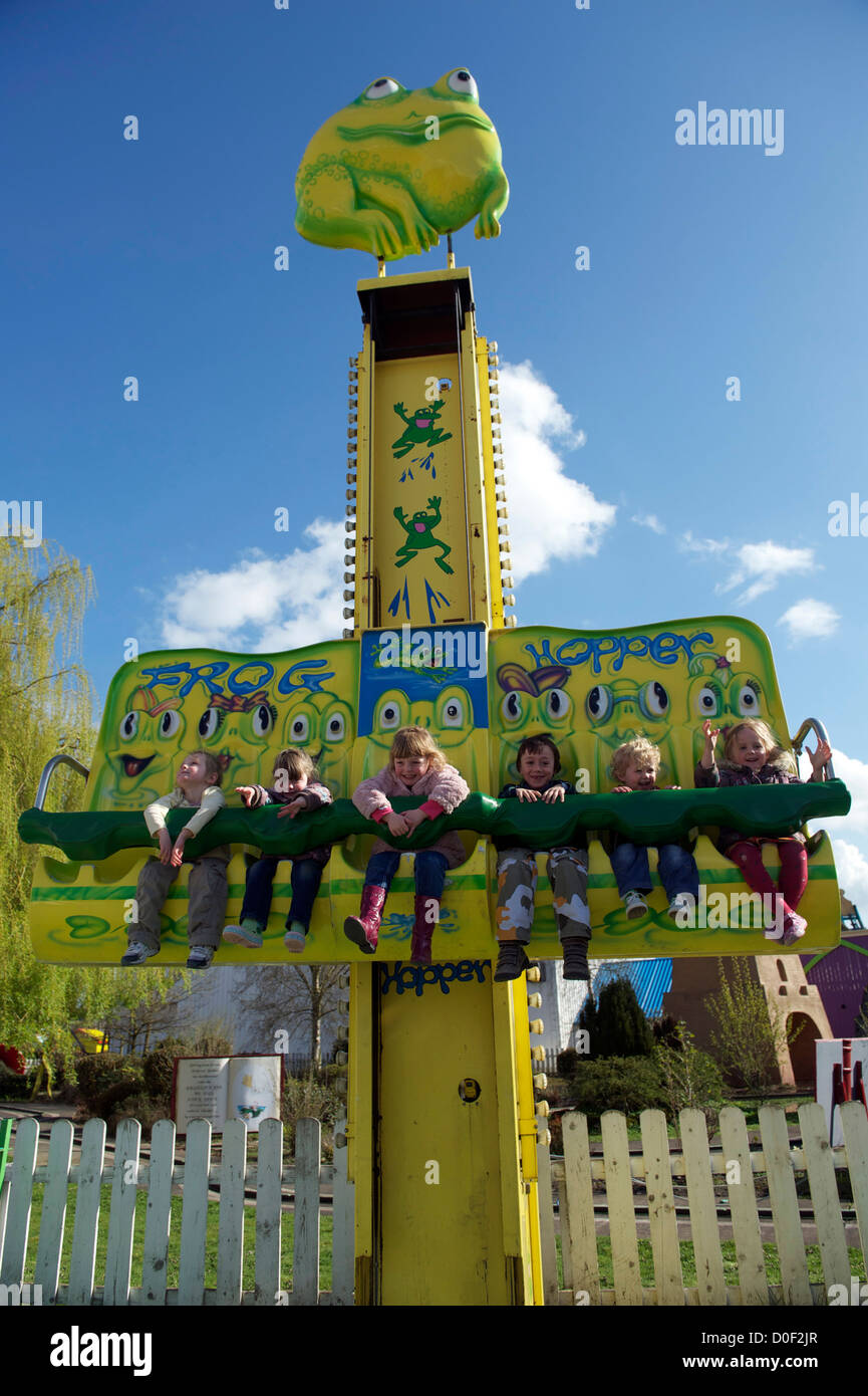 Children riding on a fairground ride at Flamingo land resort in North ...