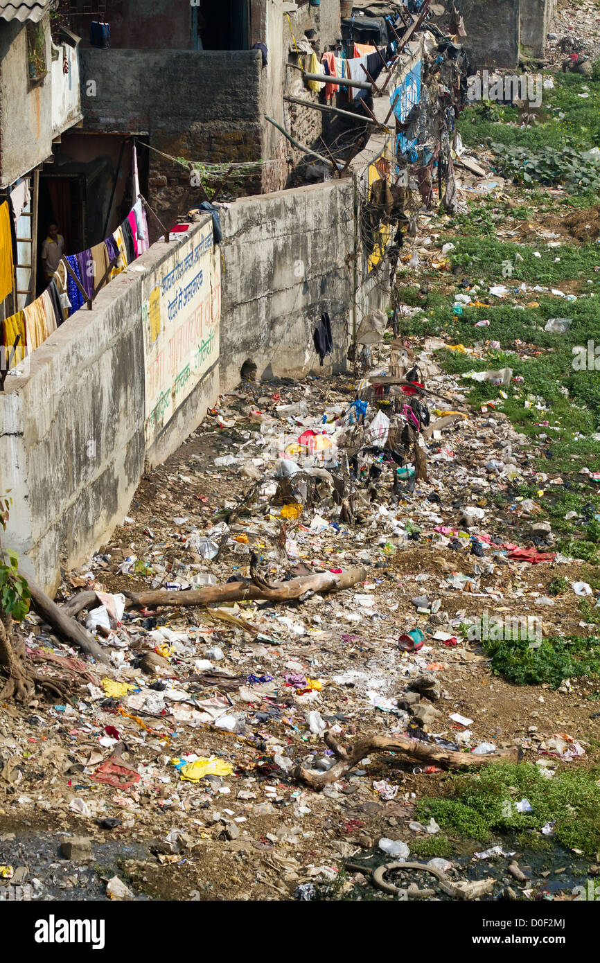 Garbage at a Wall of the Dharavi Slum in Mumbai, India Stock Photo - Alamy