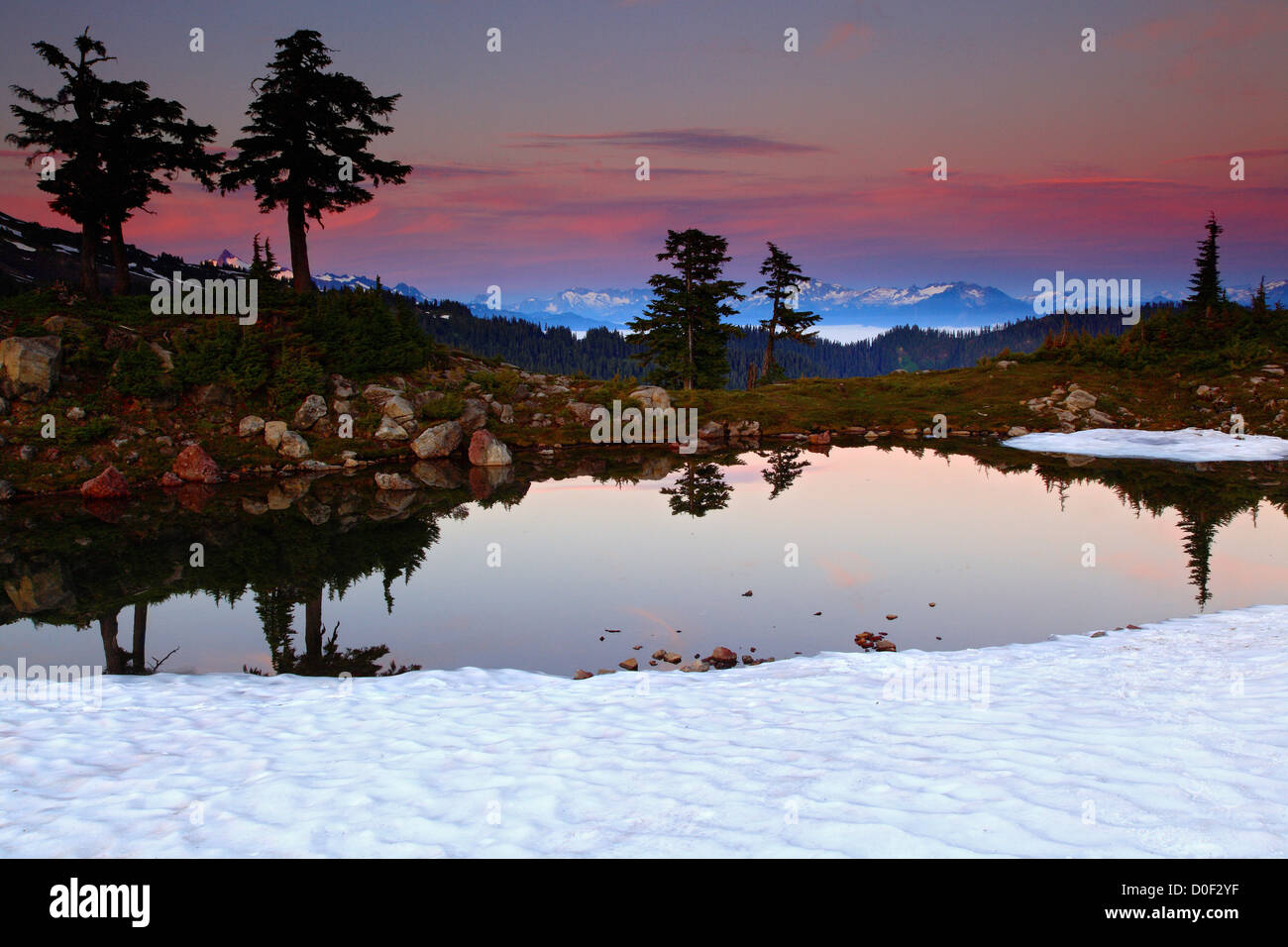 Sunset over a tarn in the North Cascades from Park Butte, Mount Baker ...