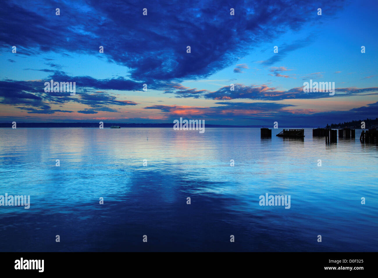 Sunset from the Kingston ferry terminal with ferry in the distance ...