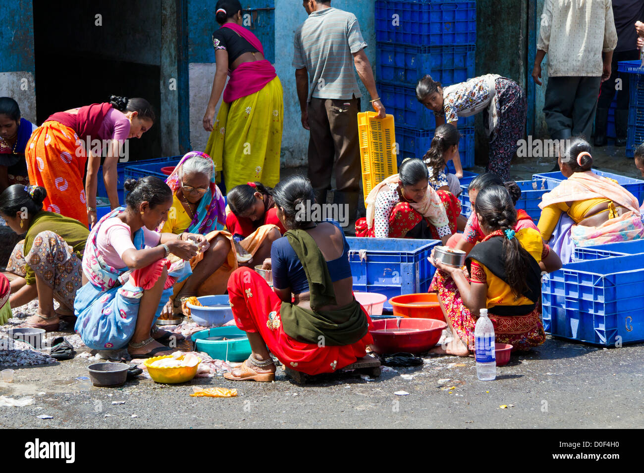 Women cleaning fresh Fish on Fish Market in Mumbai, India Stock Photo ...