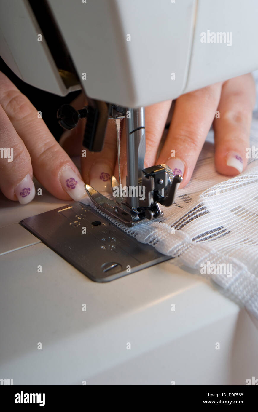 sewing on a machine Stock Photo - Alamy