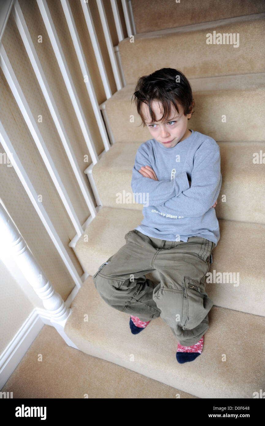 7 year old sitting on a naughty step in his parents home in North ...