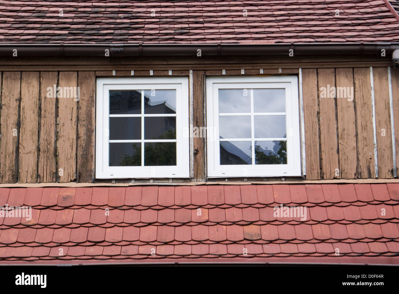 new plastic window in wooden house Stock Photo - Alamy