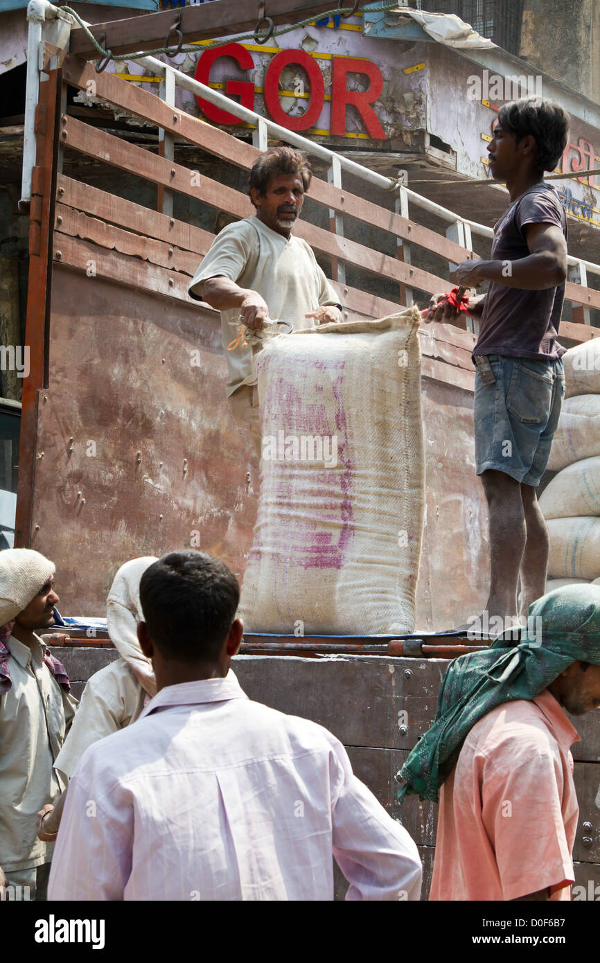 Worker Using Cement Bag