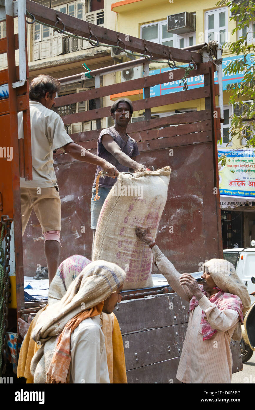 Man carrying cement bag hi-res stock photography and images - Alamy