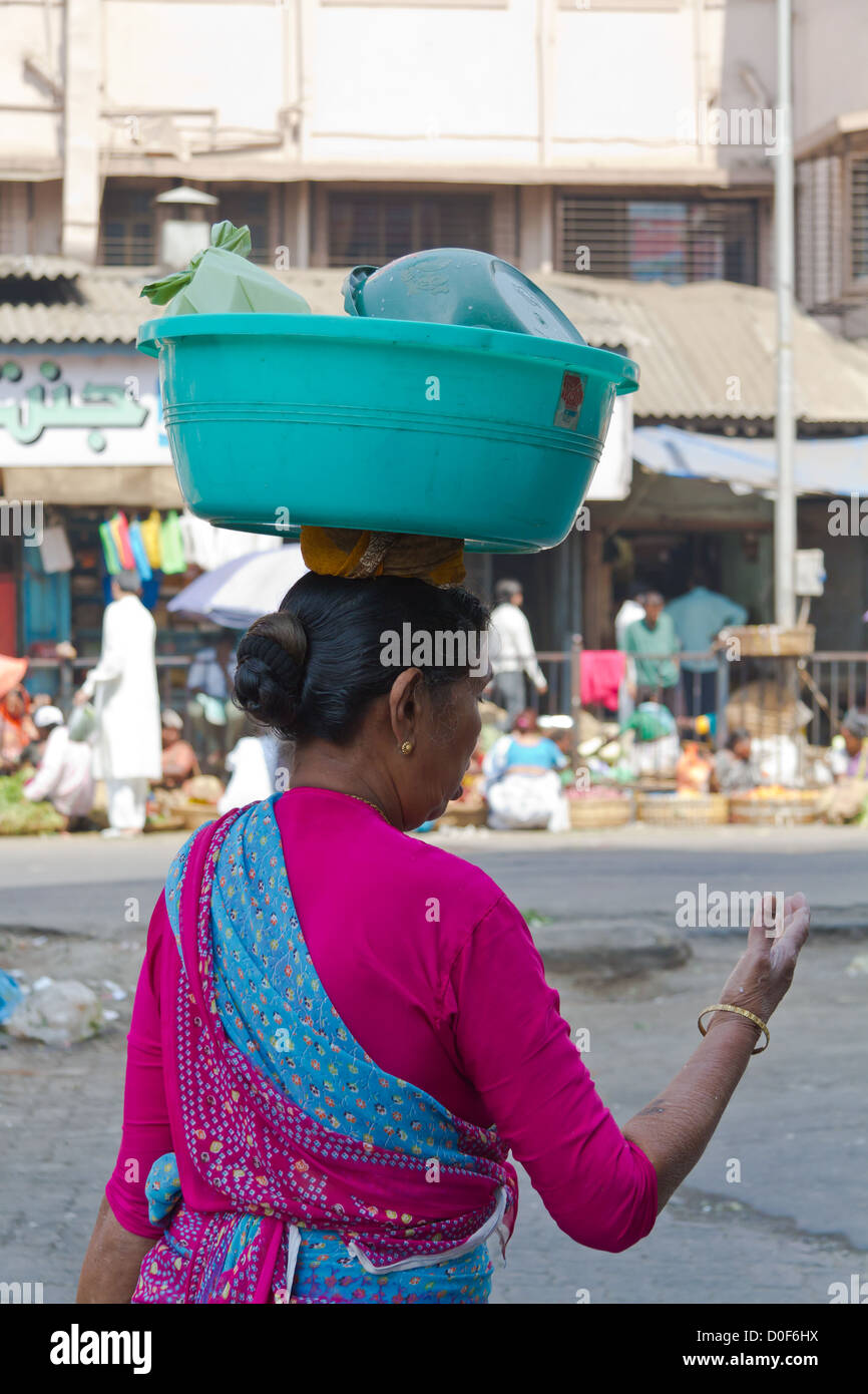 Indian woman carrying basket on her head hi-res stock photography and ...