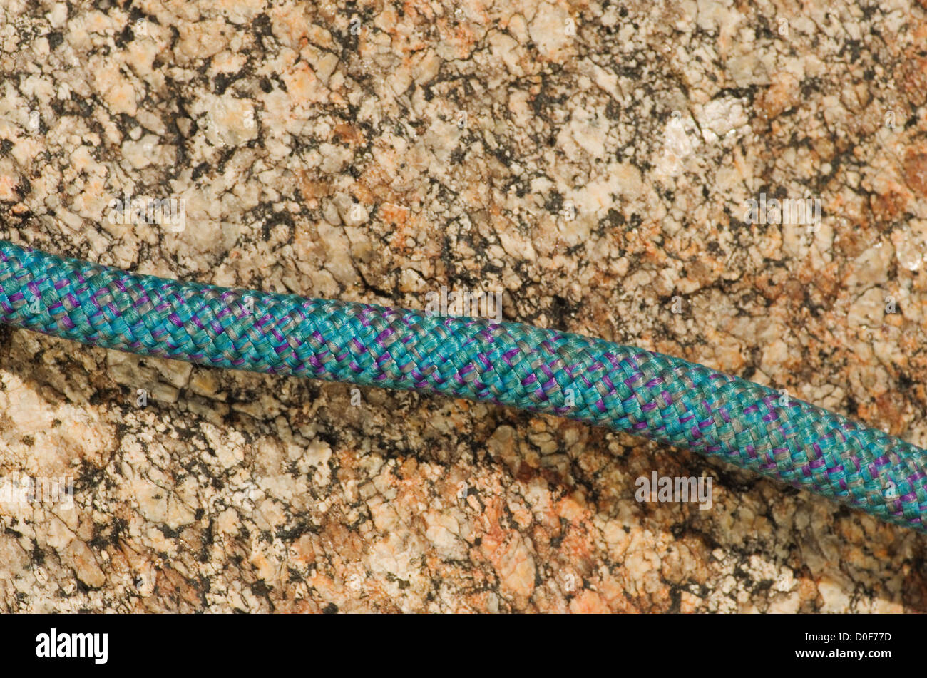 blue climbing rope detail with granite rock background Stock Photo - Alamy