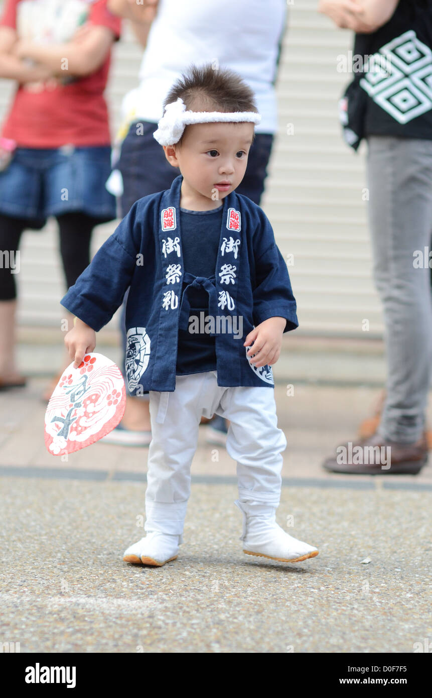 A small boy enjoying himself at the Kishiwada Danjiri festival in Osaka ...
