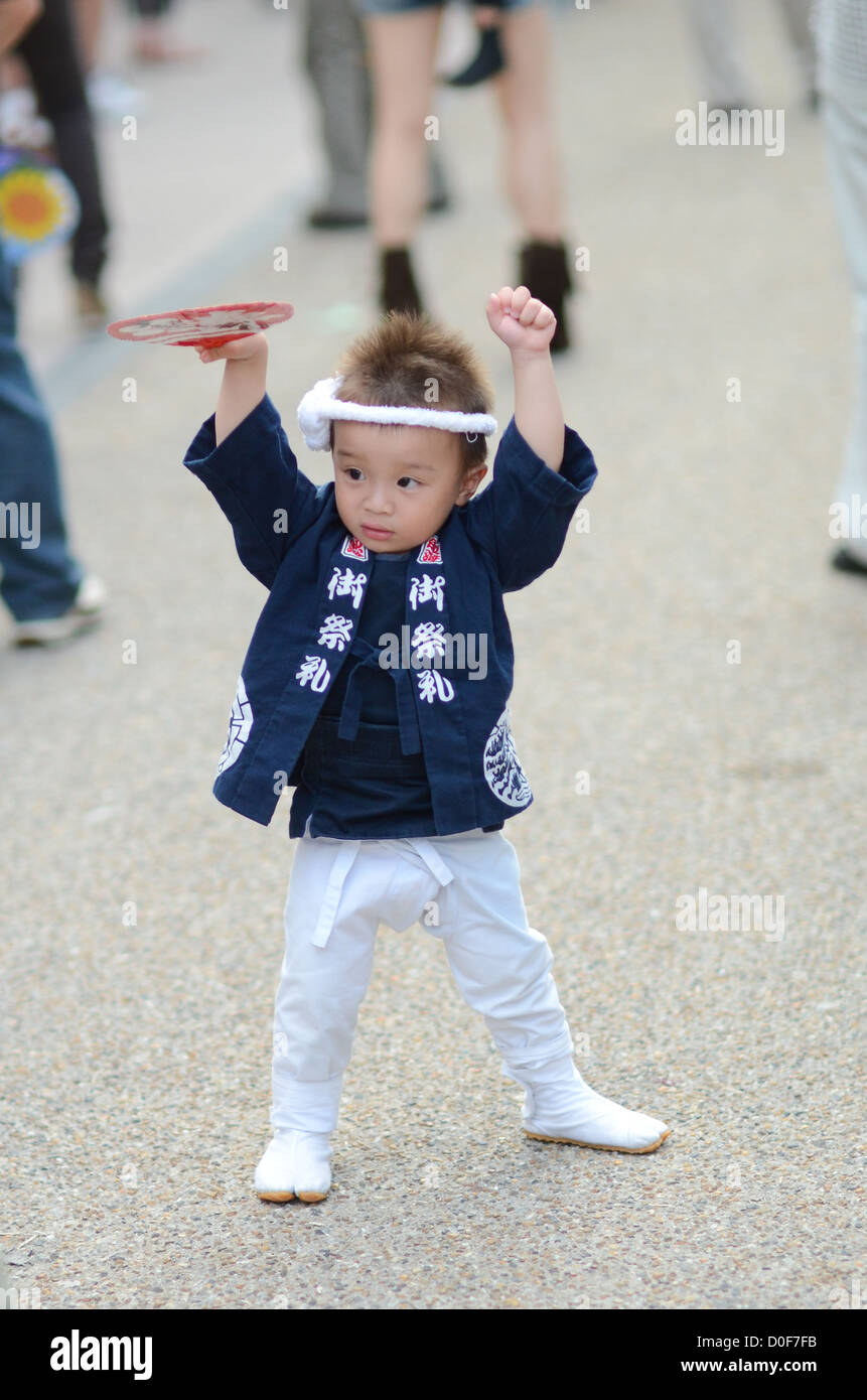 A small boy enjoying himself at the Kishiwada Danjiri festival in Osaka ...