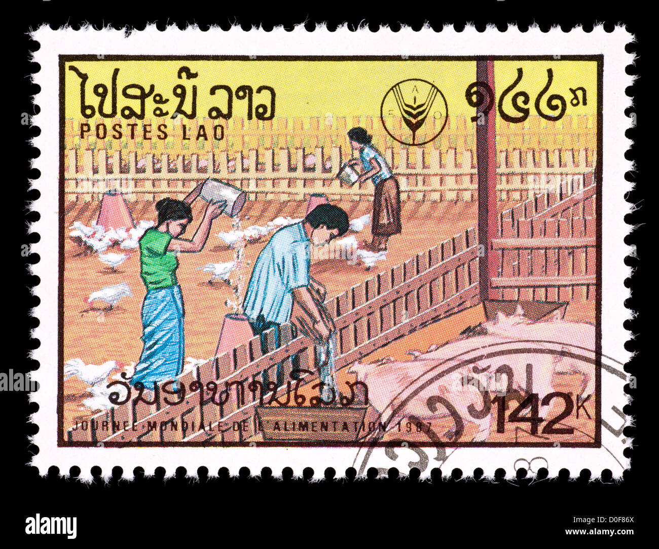 Postage stamp from Laos depicting a rural chicken farm Stock Photo - Alamy