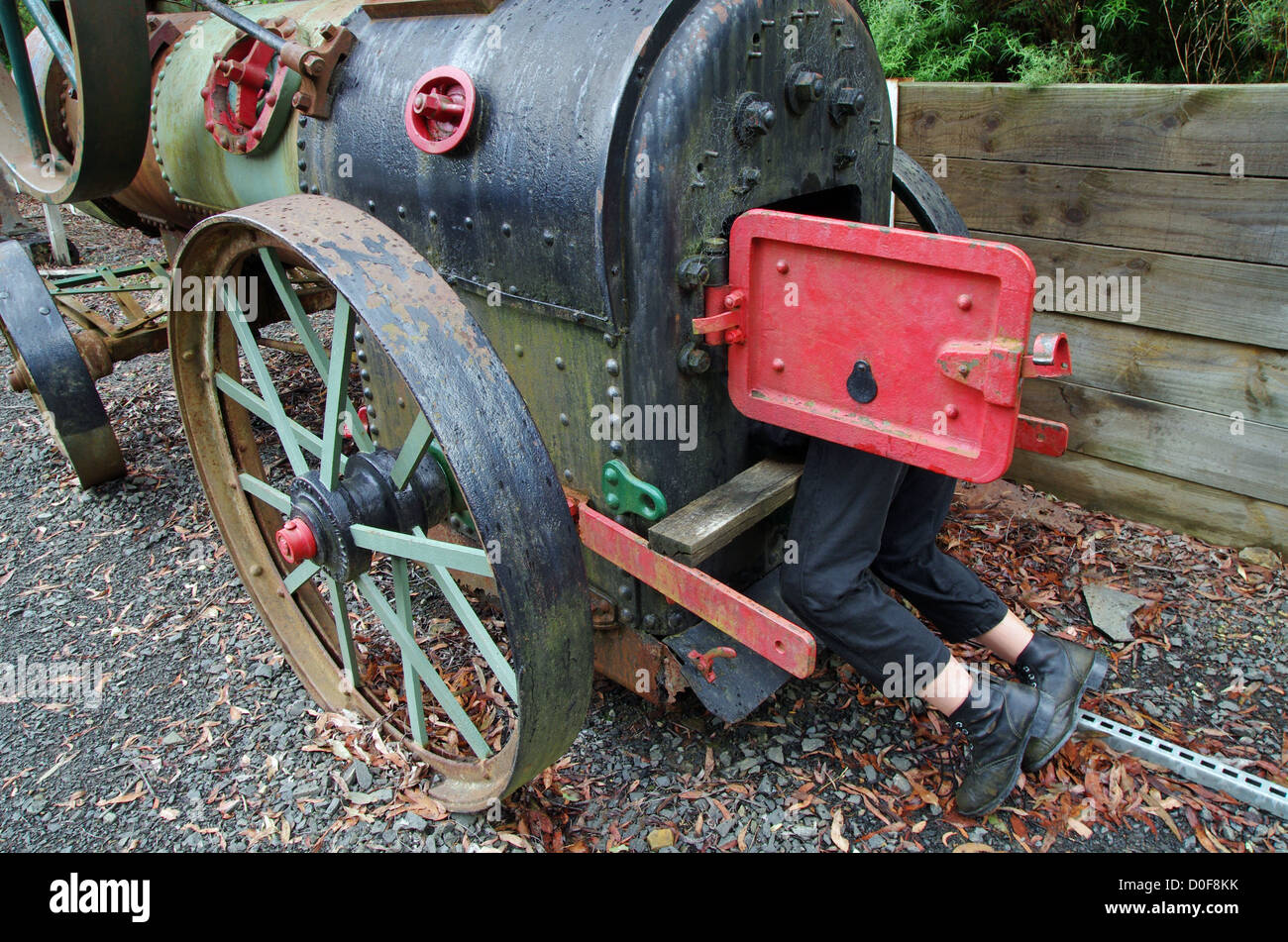 old steam traction engine with engineer working on the boiler Stock ...