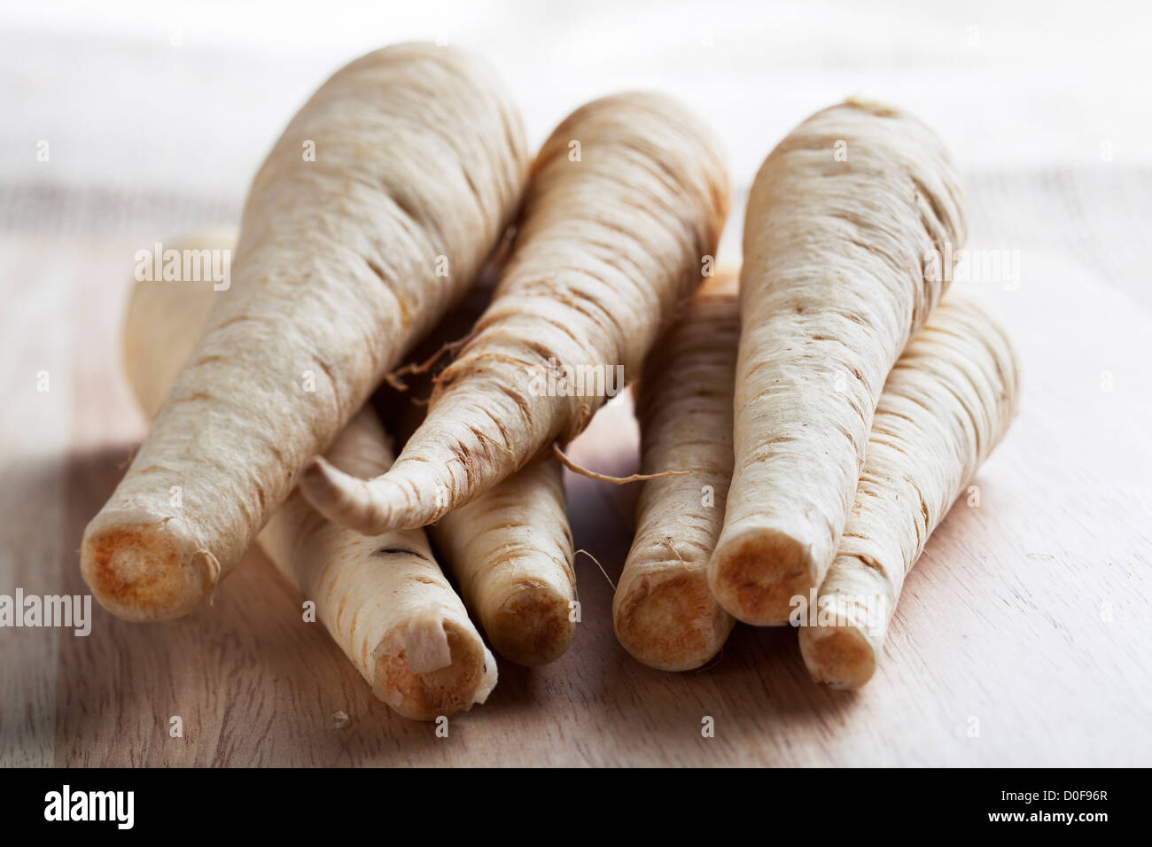 Fresh raw parsnips on a cutting board Stock Photo - Alamy
