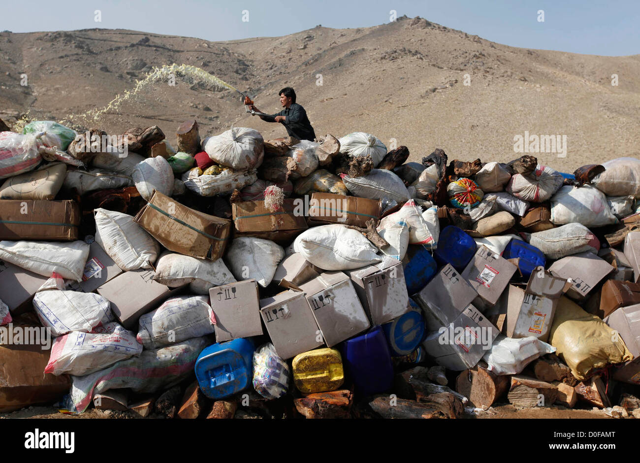 Confiscated opium is destroyed during a drug burn October 14, 2012 in ...