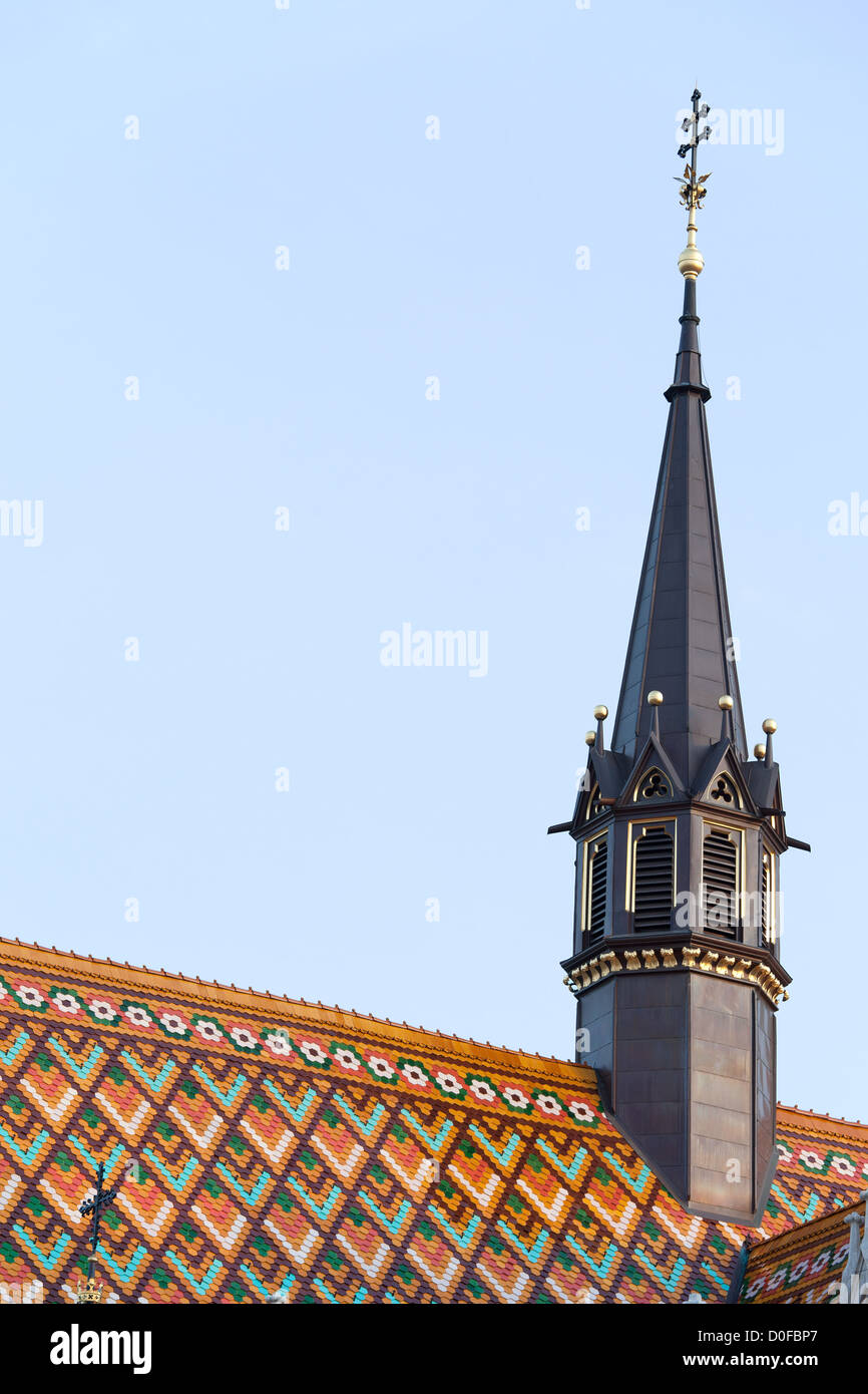 Spire and diamond shape roof tiles of the Matthias Church in Budapest ...
