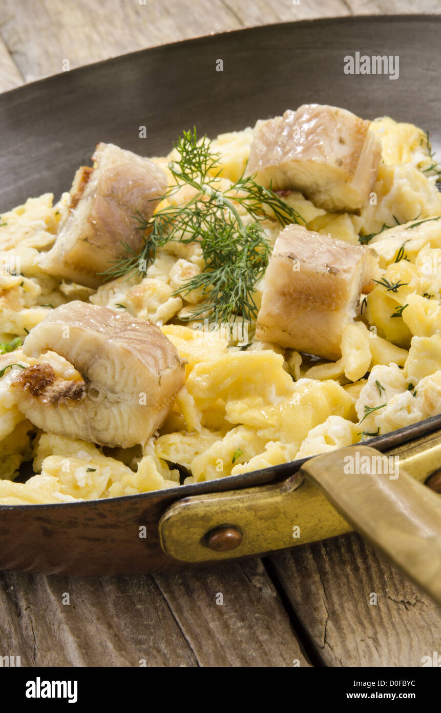 smoked eel with scrambled eggs in a copper pan Stock Photo - Alamy