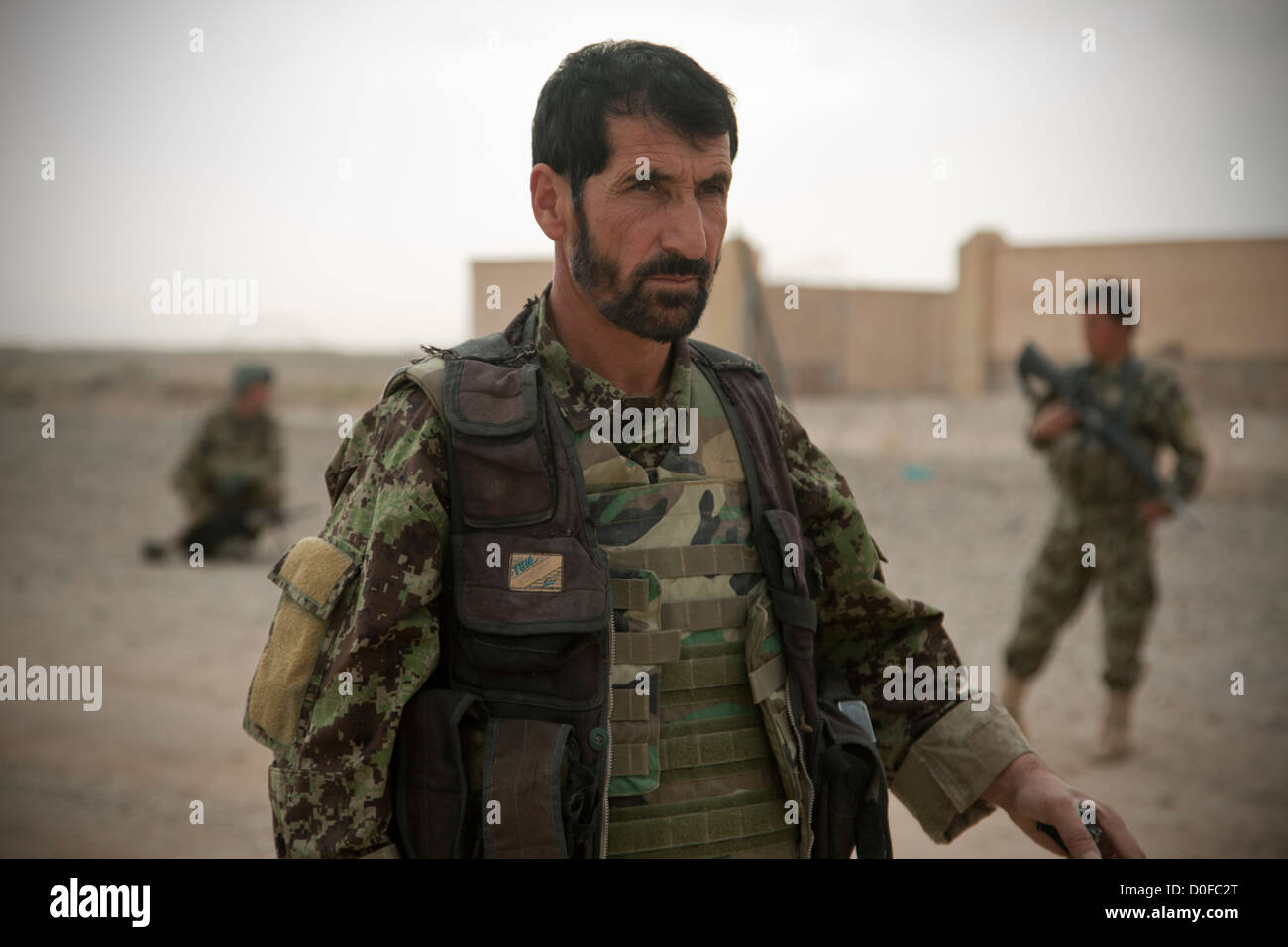 An Afghan National Army Commando maintains security during an Afghan ...