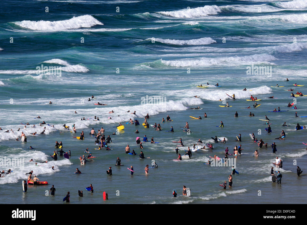Surfers on the beach, Portreath village; Cornwall County; England; UK ...