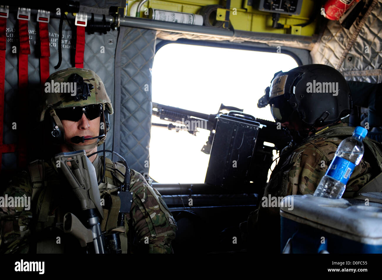 US Navy soldiers rides in a CH-47 Chinook helicopter during a mission ...
