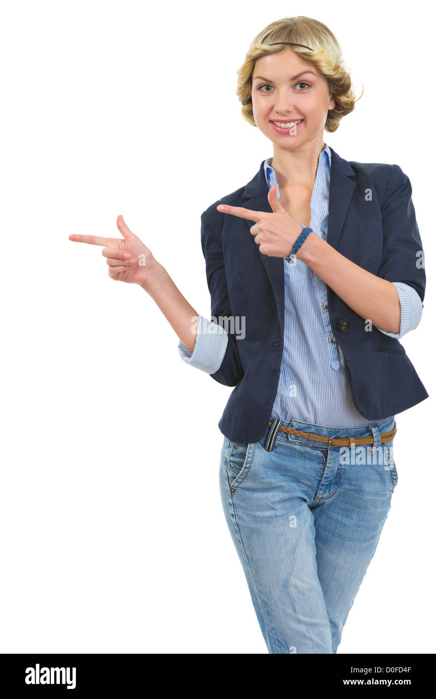 Smiling girl pointing on copy space Stock Photo - Alamy