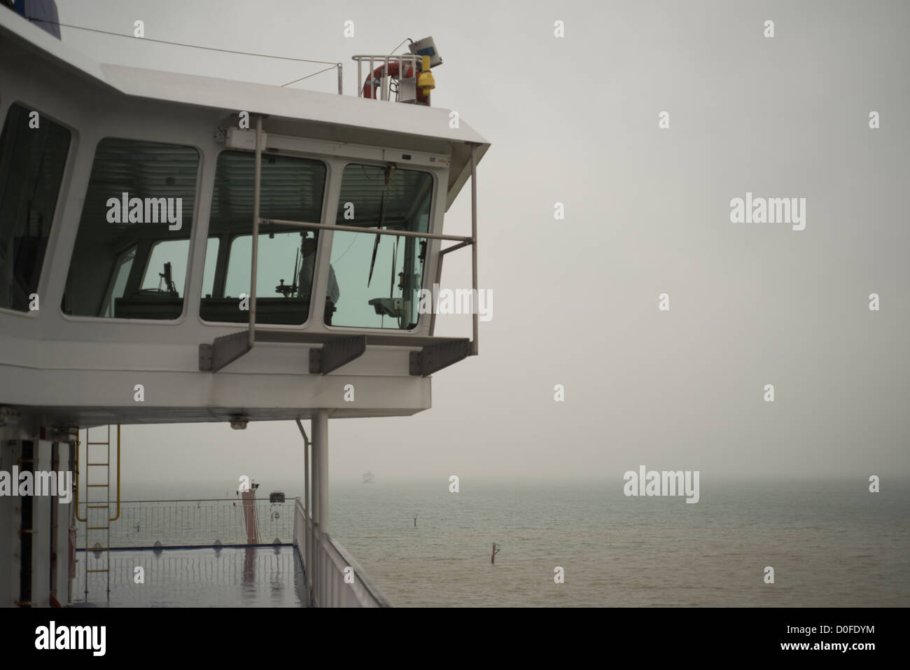 Man on the bridge of the Isle of Wight ferry Stock Photo - Alamy