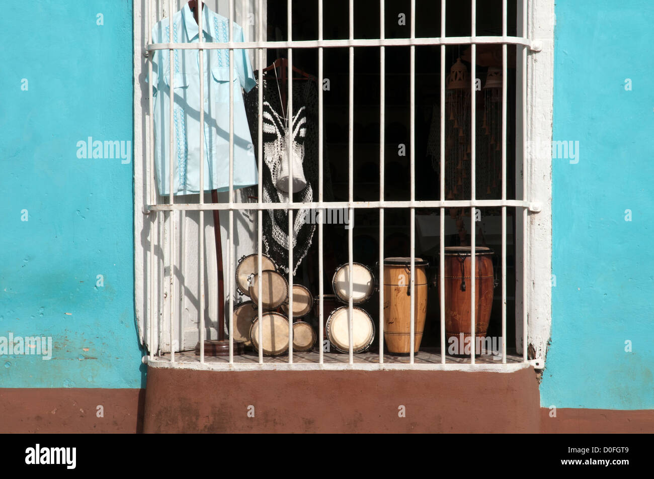 Musical instrument behind the bars of a window Stock Photo - Alamy