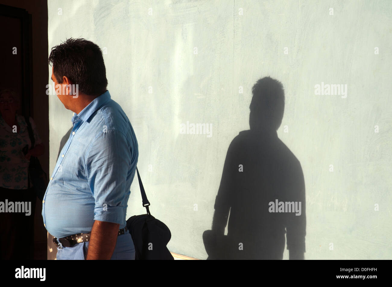 A man with his shadow Stock Photo - Alamy