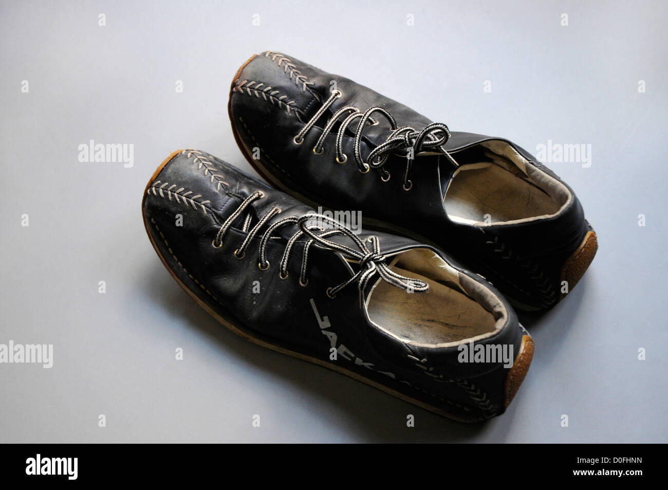old shoes in a grey back ground, old shoe laces, shoes worn, old Stock ...