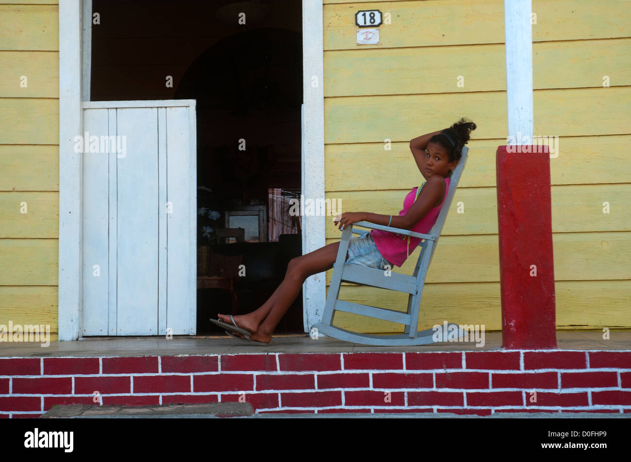 A lady on a rocking chair Stock Photo - Alamy