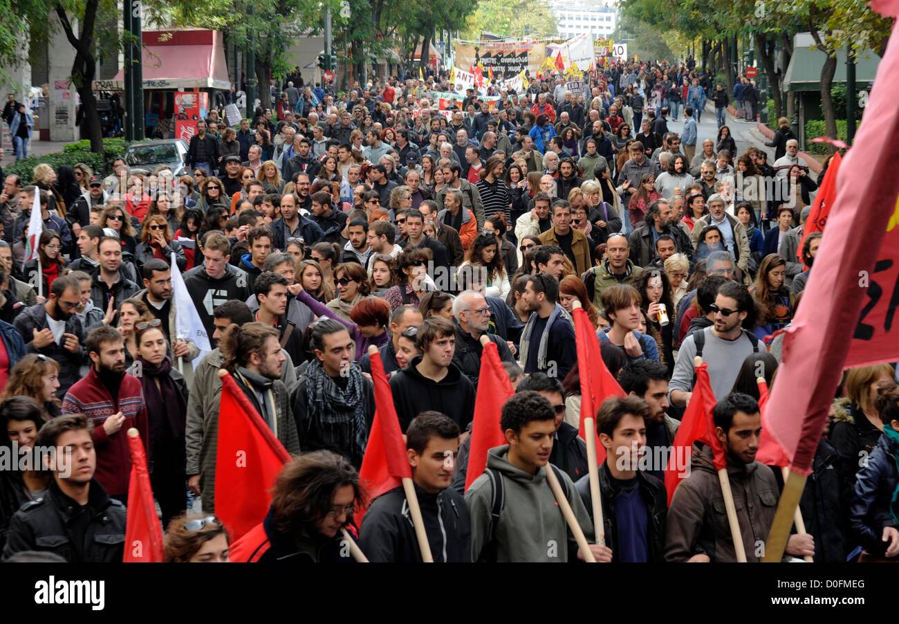 Hundreds of protesters marching along a road during an anti-fascist ...