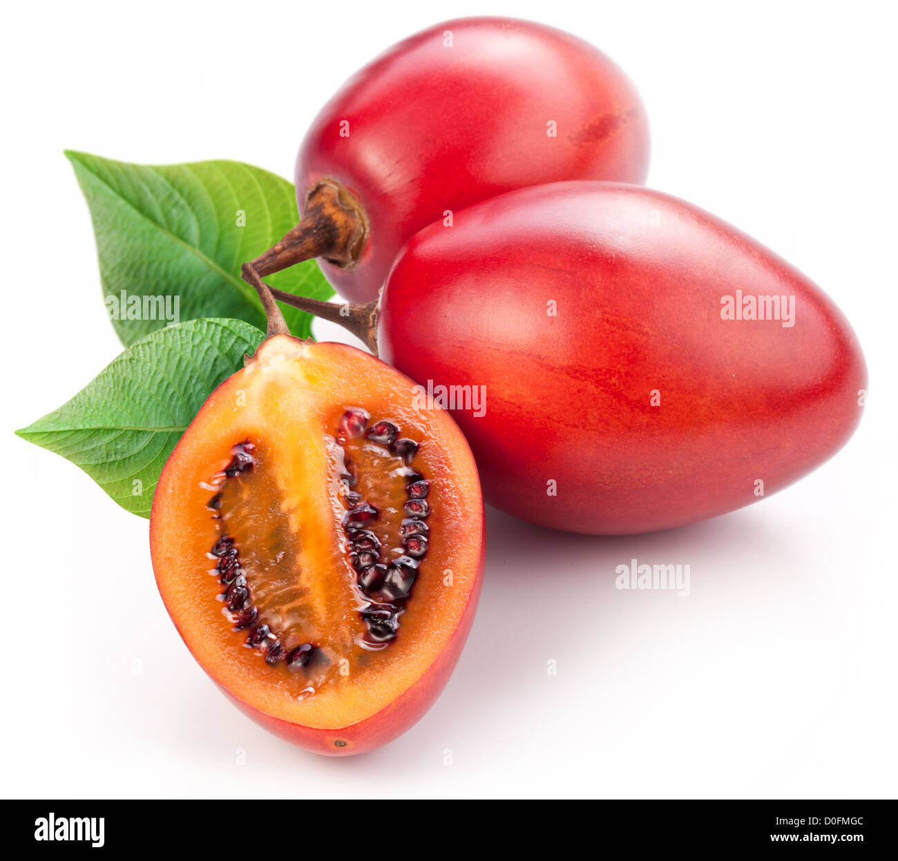 Tamarillo fruits with leaves on white background Stock Photo - Alamy