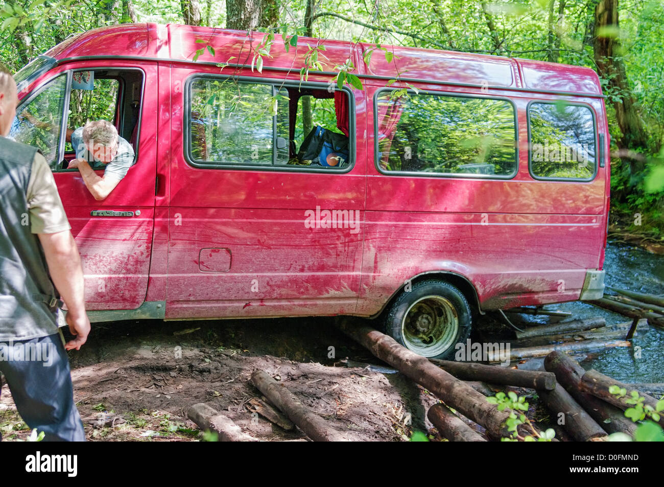 Minibus on broken wooden bridge Stock Photo - Alamy