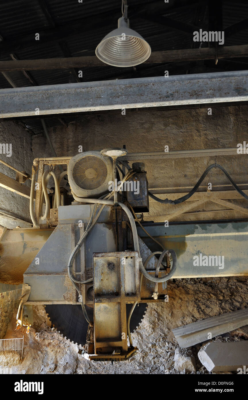 Dust covered cutting wheel in abandoned marble processing factory ...