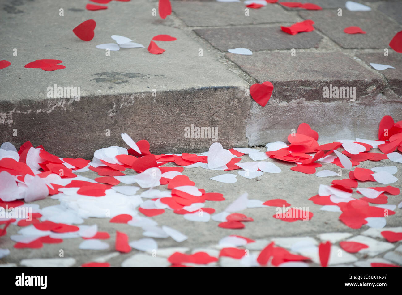 love heart shaped confetti on steps of church Stock Photo - Alamy