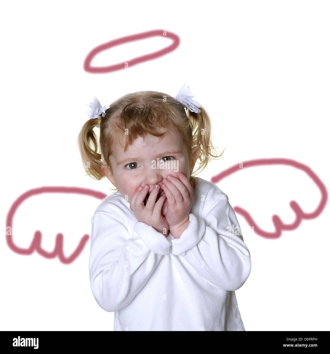 Little girl angel with funny expression on her face Stock Photo - Alamy