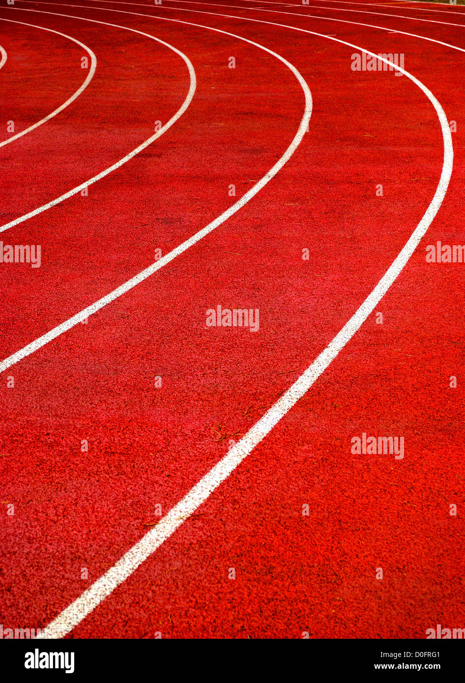 Lanes of a race track with a curve at the end Stock Photo - Alamy