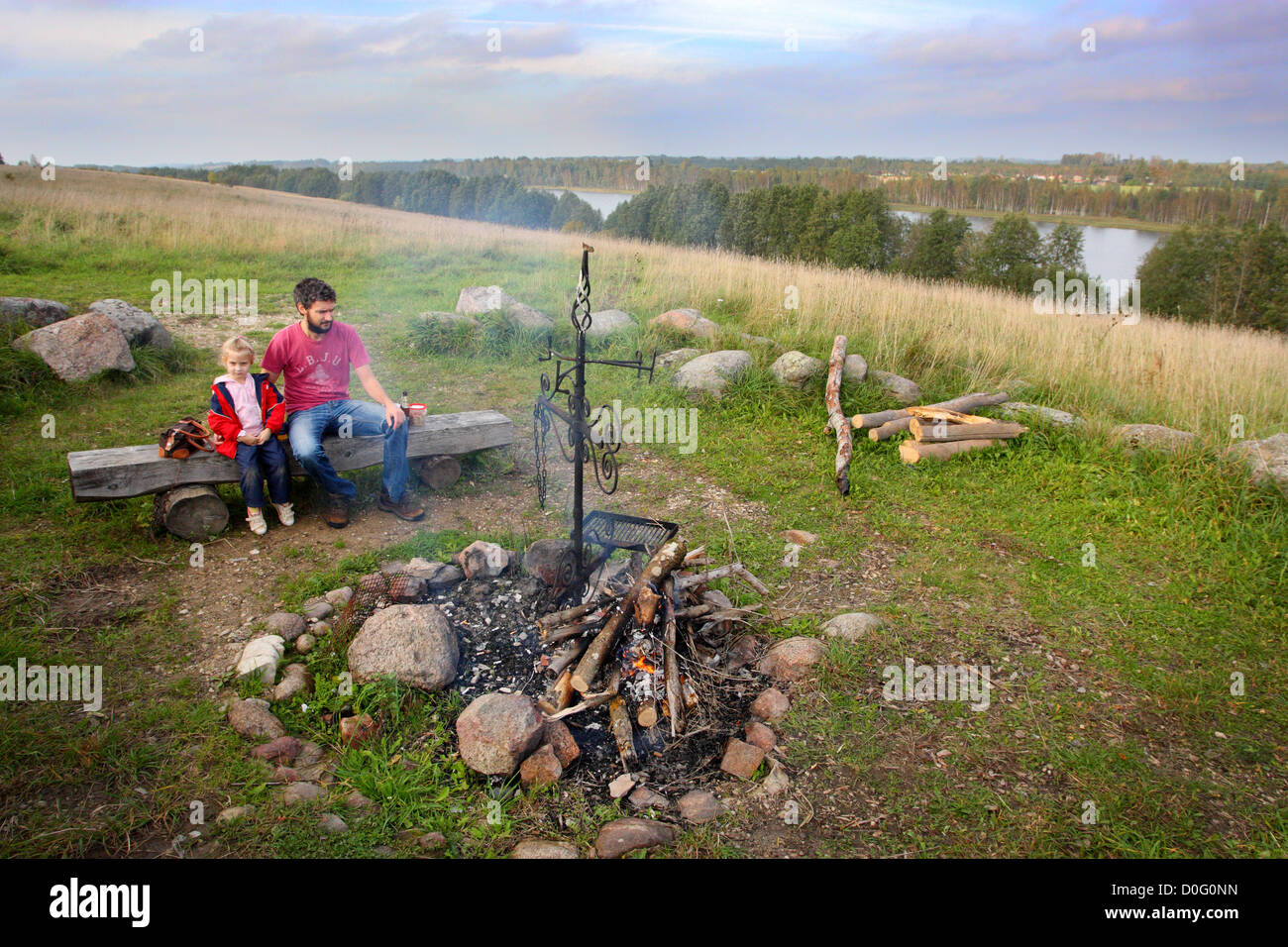 Sitting around fire uk hi-res stock photography and images - Alamy