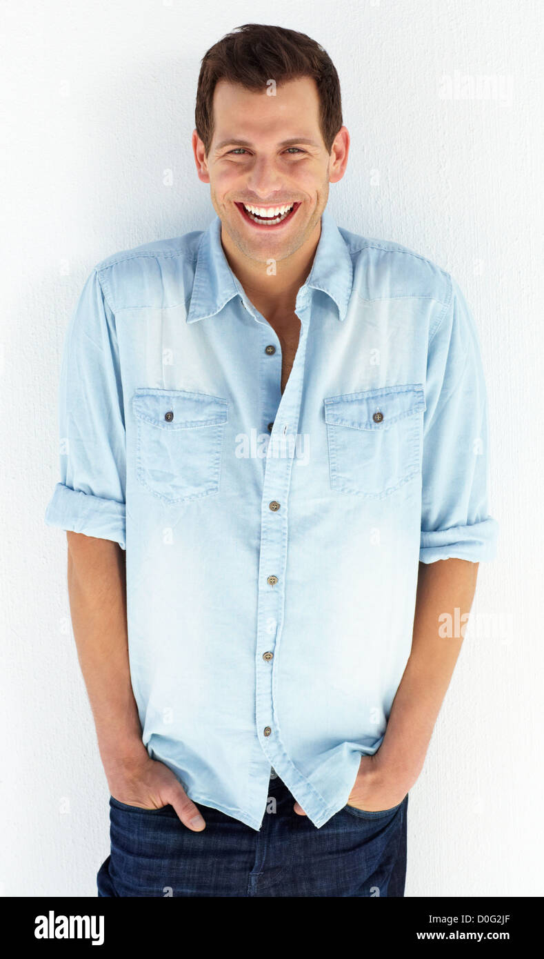 Young male poses awkwardly, with a brilliant and bashful smile Stock ...