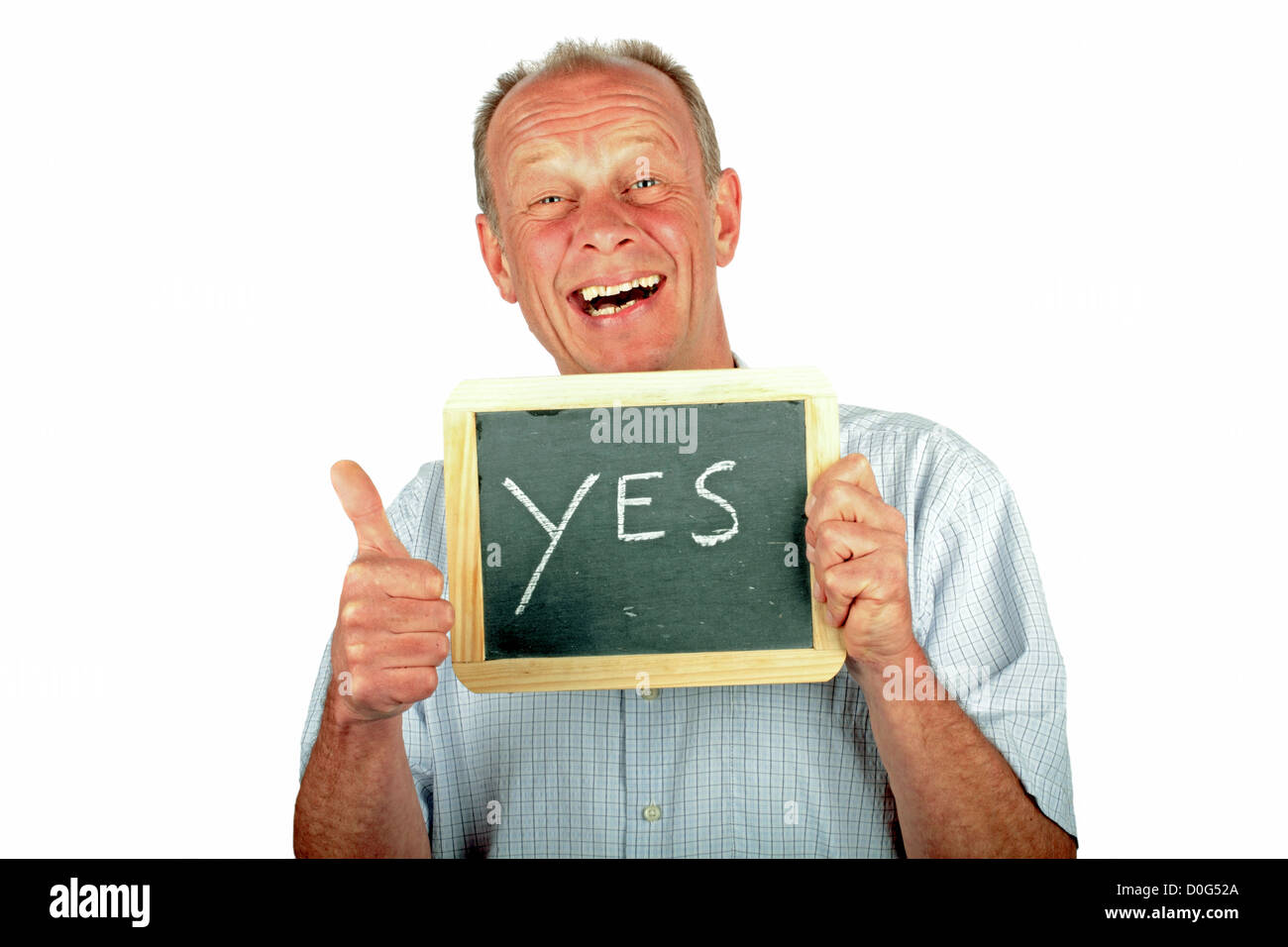 Positive man showing thumbs up with sign '' yes'' Stock Photo - Alamy