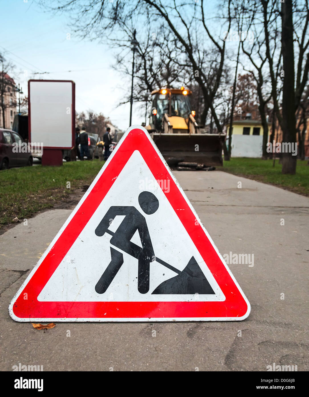Roadworks sign on the asphalt urban lane Stock Photo - Alamy