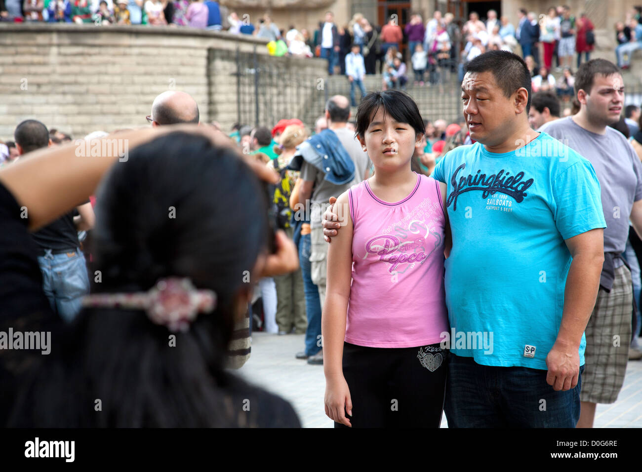 Chinese man and woman posing for photograph Stock Photo - Alamy