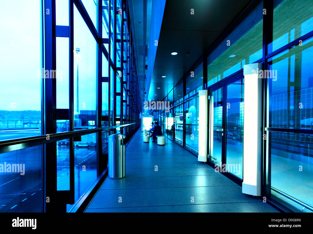 View of modern interior of airport, toned in blue color Stock Photo - Alamy