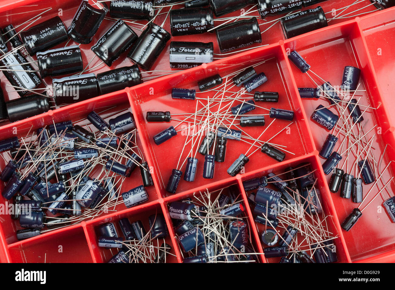Close up of capacitors in a red plastic box Boxed Electrical PCB ...