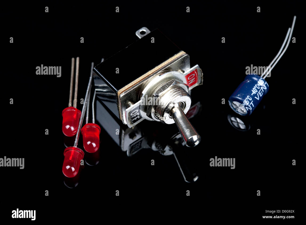 Close up of a switch with on and off labeled with LEDs and capacitors ...